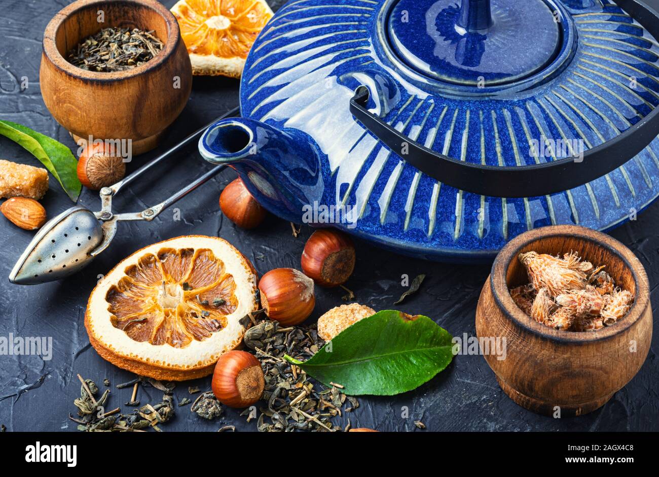 Natural ingredients for tea.Porcelain blue teapot.Useful tea with lemon ...
