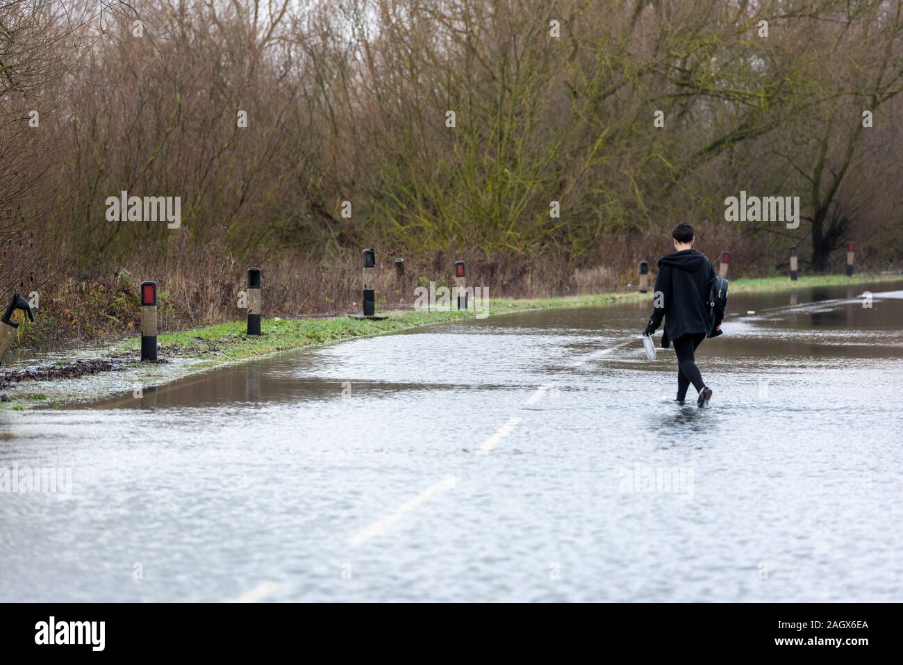 Woman walks through heavy rain hi-res stock photography and images - Alamy