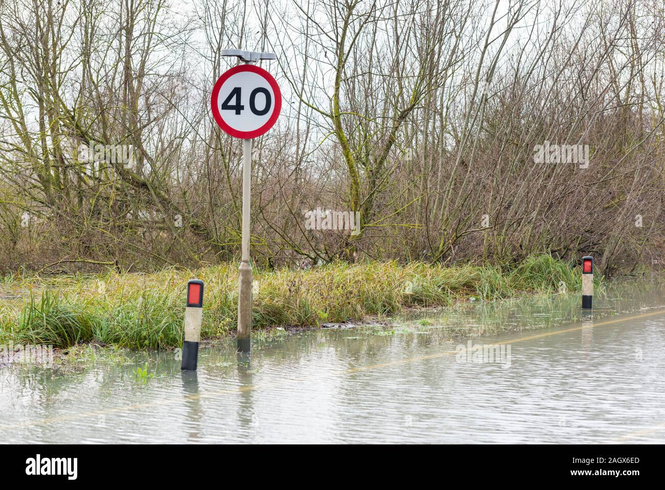 Earith, UK. 22nd Dec, 2019. The River Great Ouse floods roads and ...