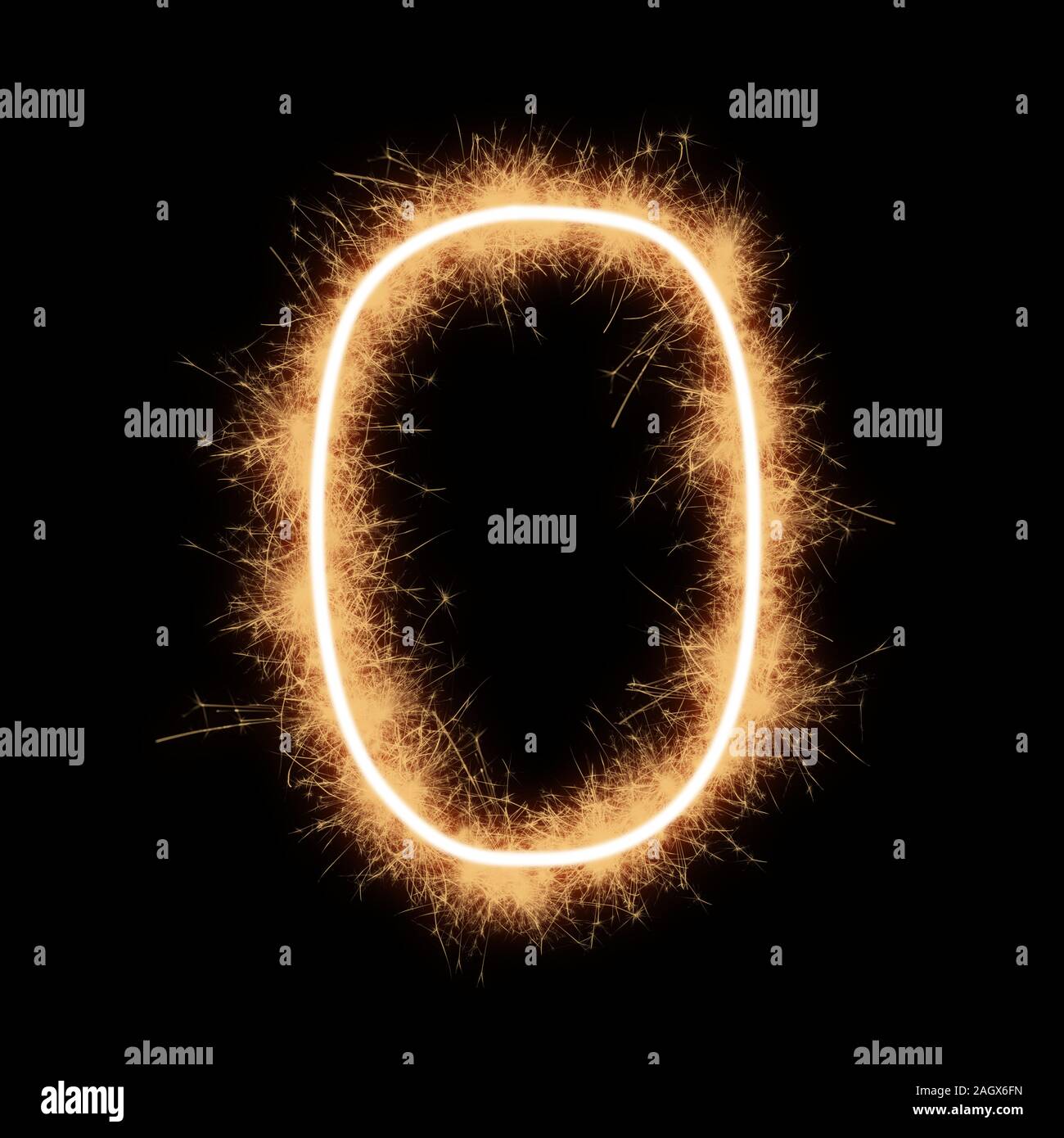 Symbol of number zero written by squib sparks on a black background ...
