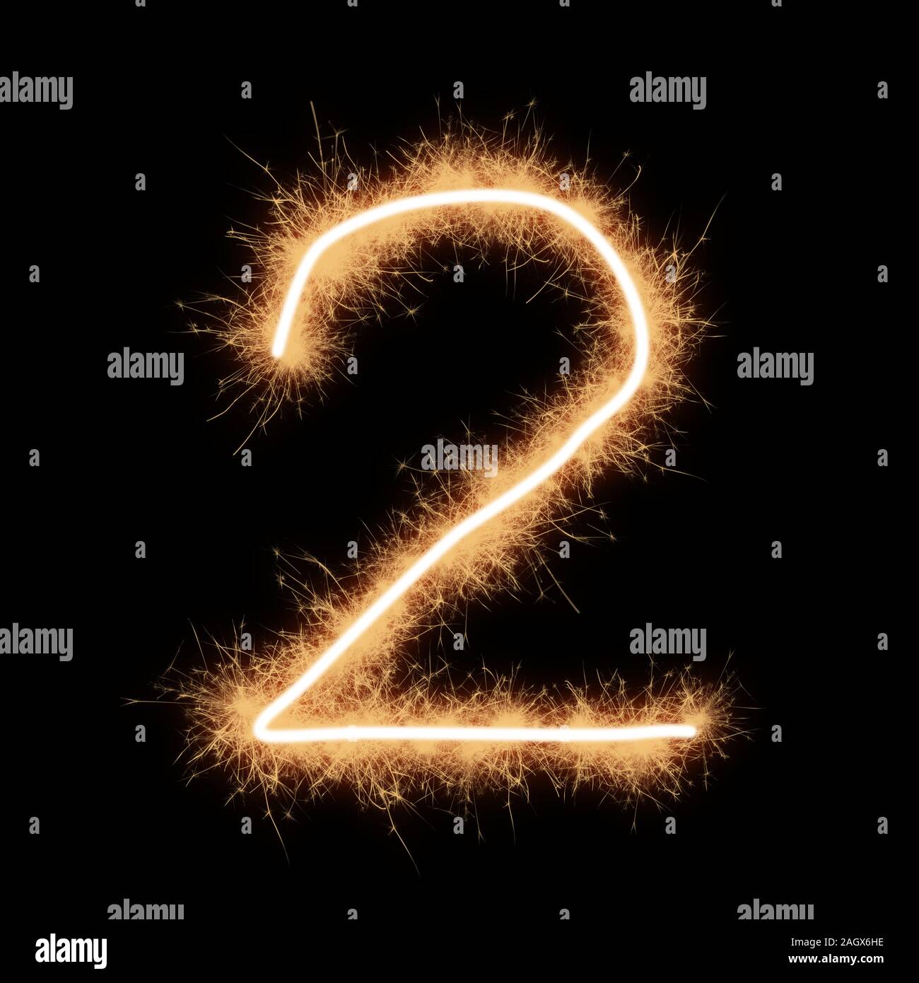 Symbol of number two written by squib sparks on a black background ...