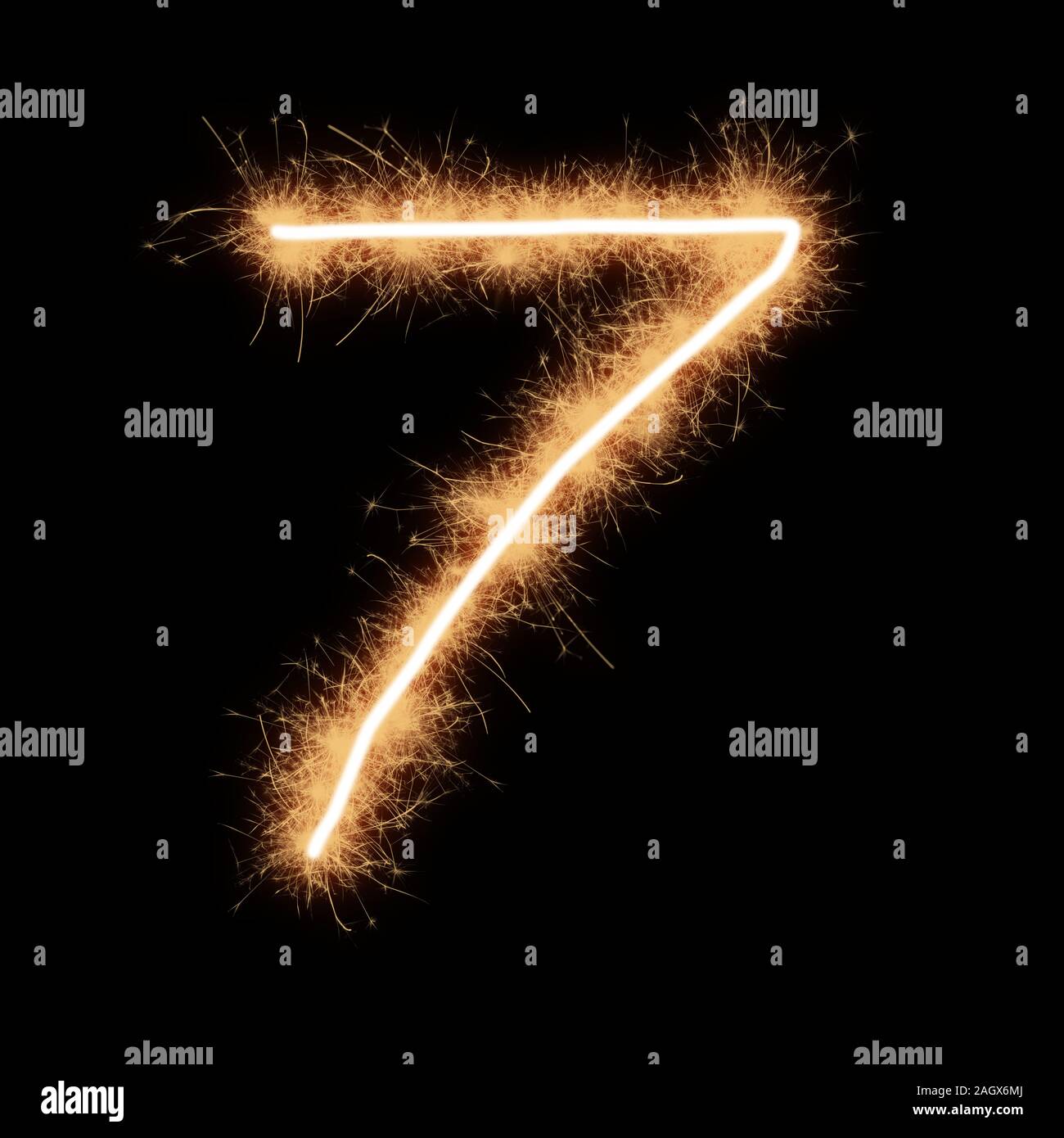Symbol of number seven written by squib sparks on a black background ...