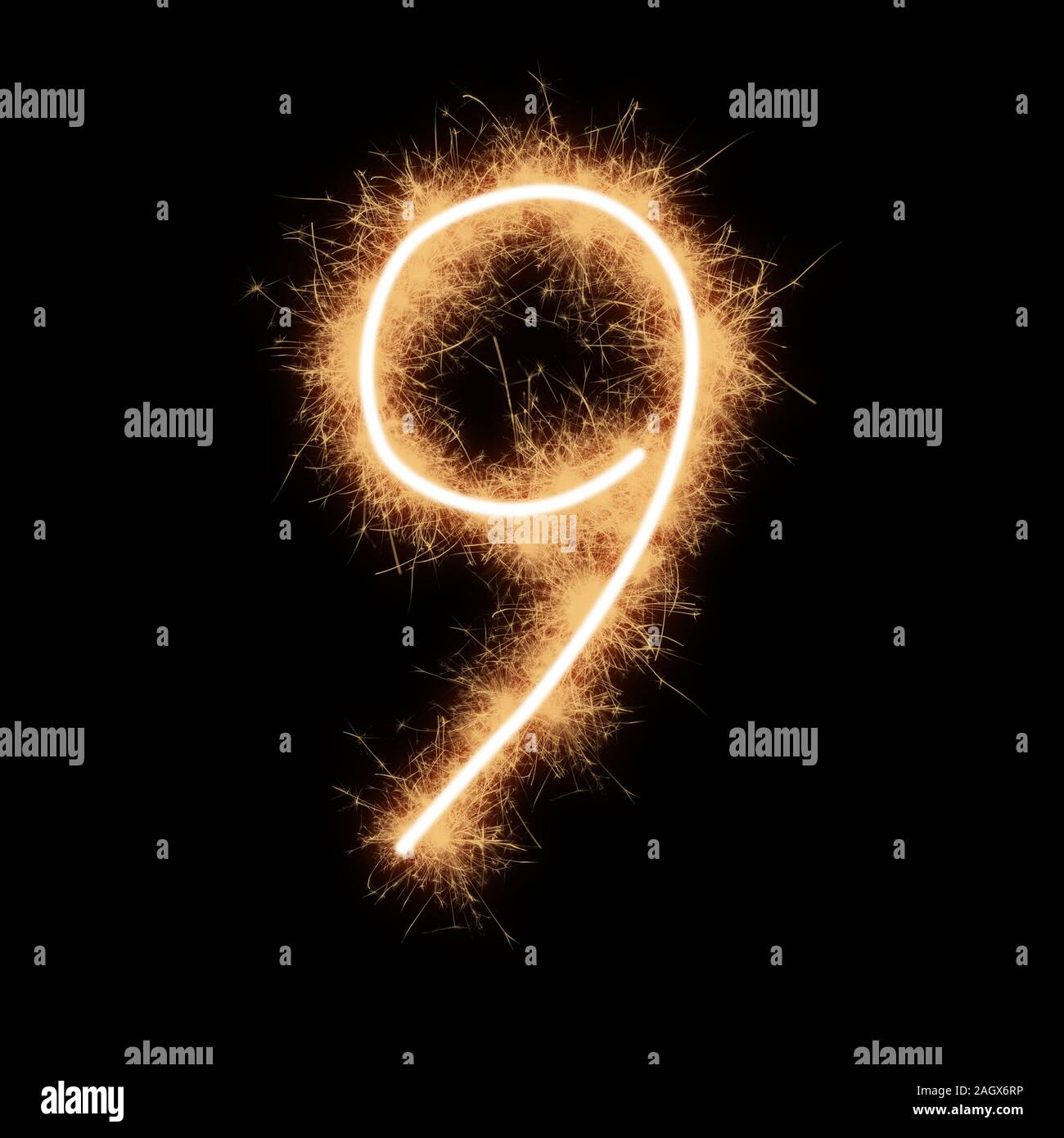 Symbol of number nine written by squib sparks on a black background ...