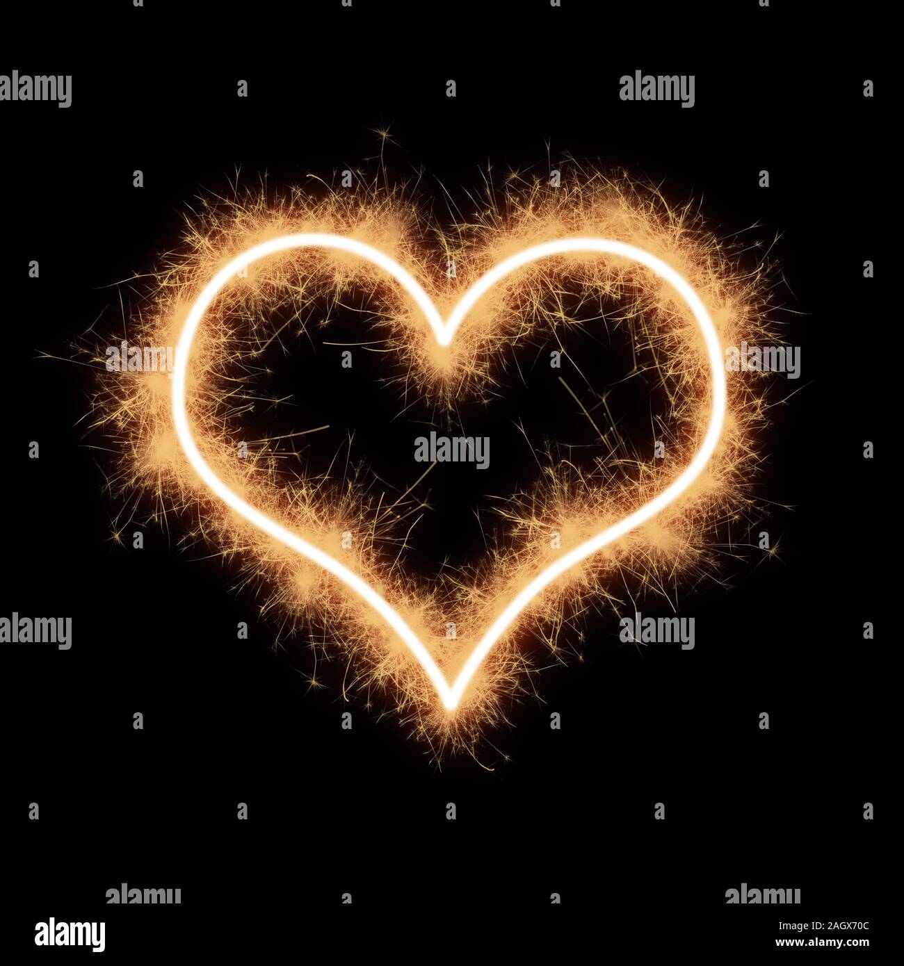 Heart shape symbol by squib sparks on a black background Stock Photo ...