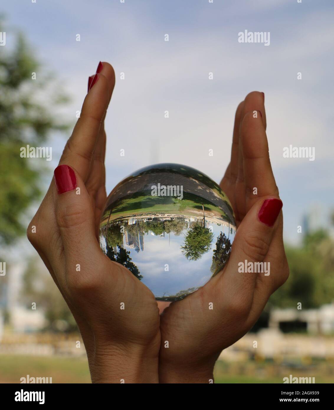 Glass ball in hands and nature hi-res stock photography and images - Alamy