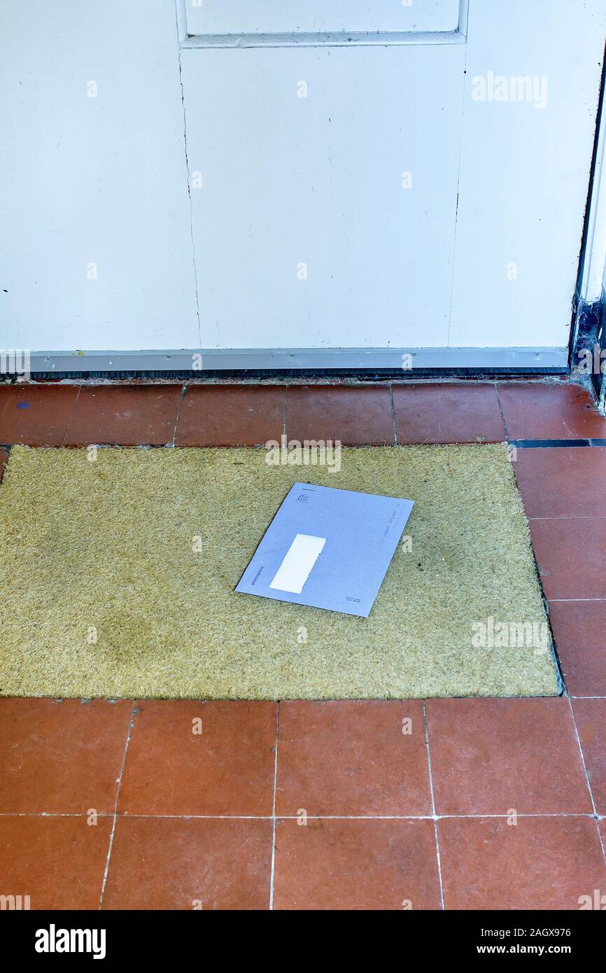 Blue envelope from the Dutch tax office on the doormat Stock Photo - Alamy