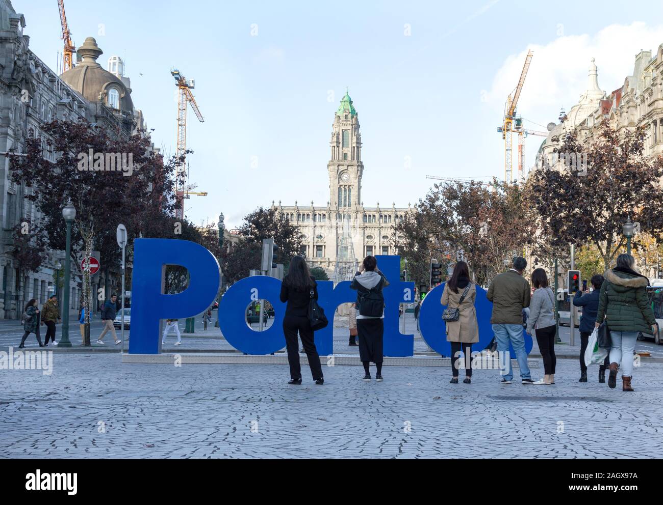 Back view of anonymous travelers admiring and shooting blue Porto ...