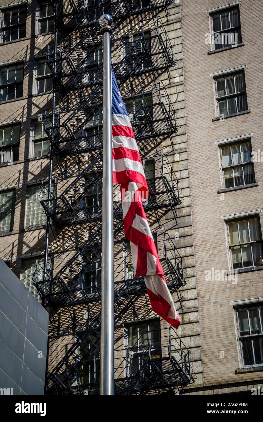 American flag and Fire escape stairs on Downtown Loop building, Chicago ...