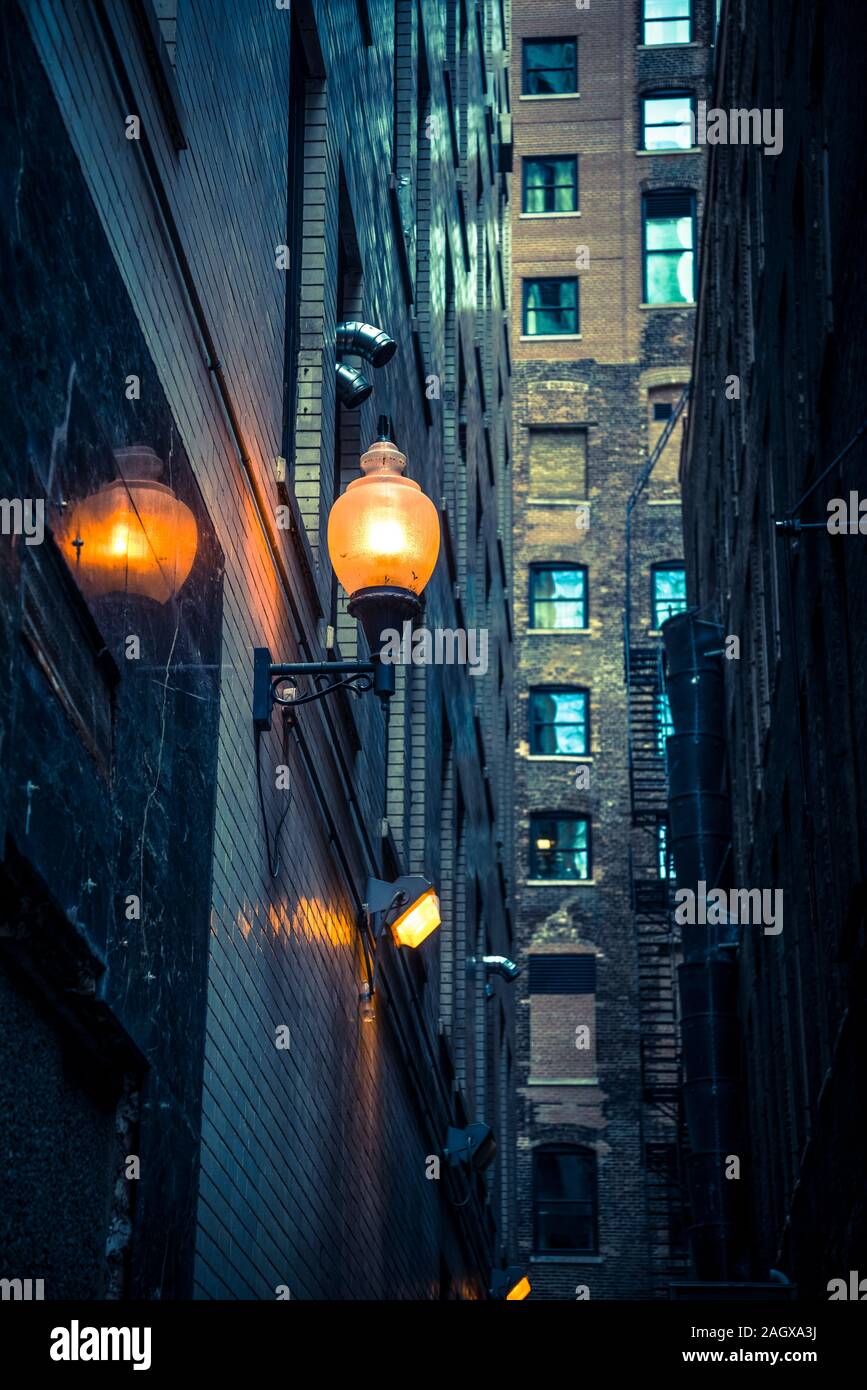 Typical narrow back alley between high-rise blocks in downtown Chicago ...