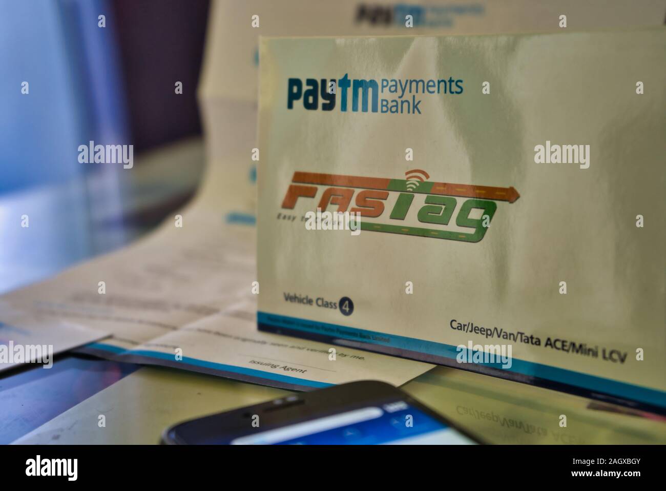 Fast Tag along with a mobile phone on the table, the application form ...