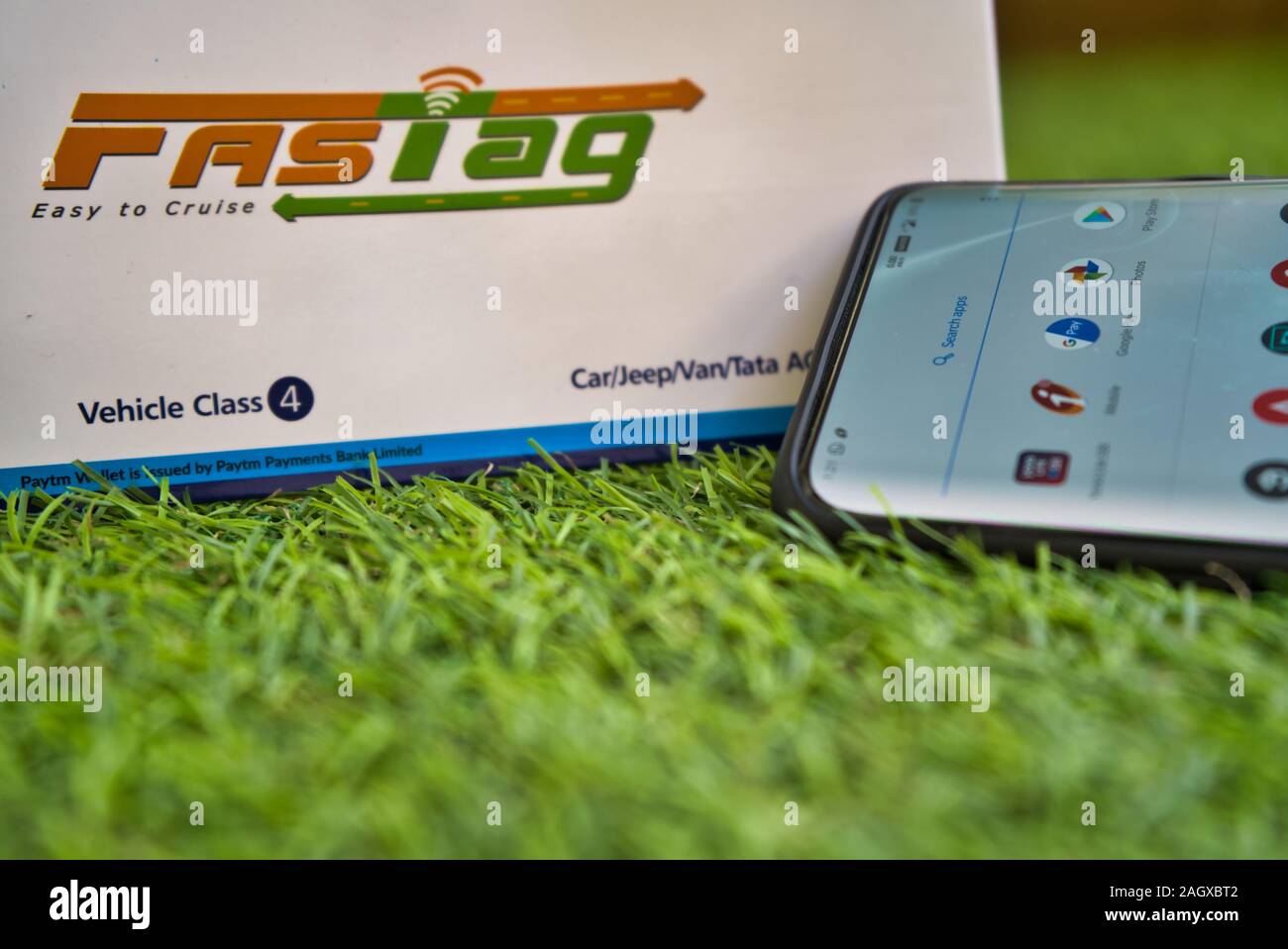 Fast Tag provided on green grass with a mobile phone showcasing ...