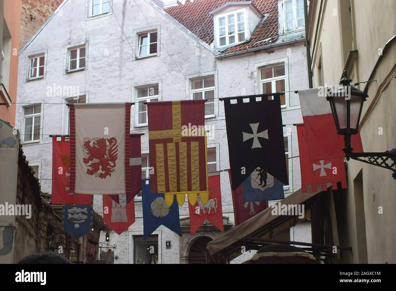Flags with the arms of the Hanseatic League on the narrowest street of ...