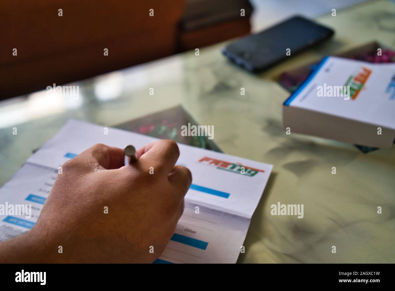 Fast Tag application form being filled with a fountain pen, along with ...