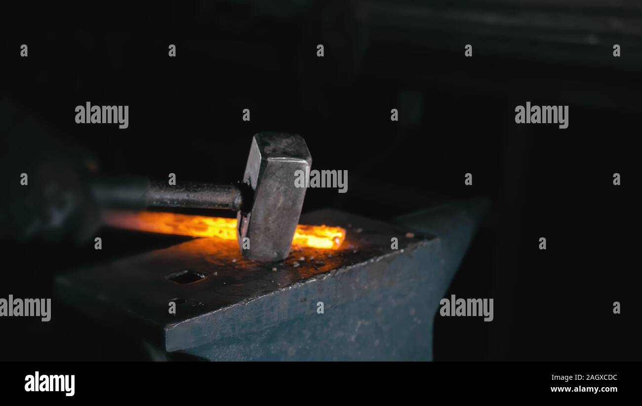 Forge workshop. Smithy manual production. Hands of smith with hammer ...