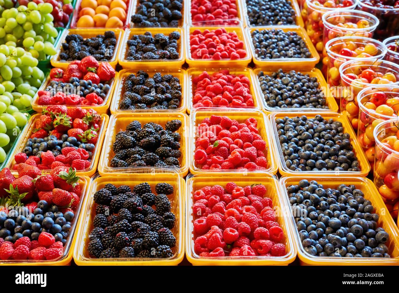 Fresh berries at display on the farmers market stall. Blueberry ...