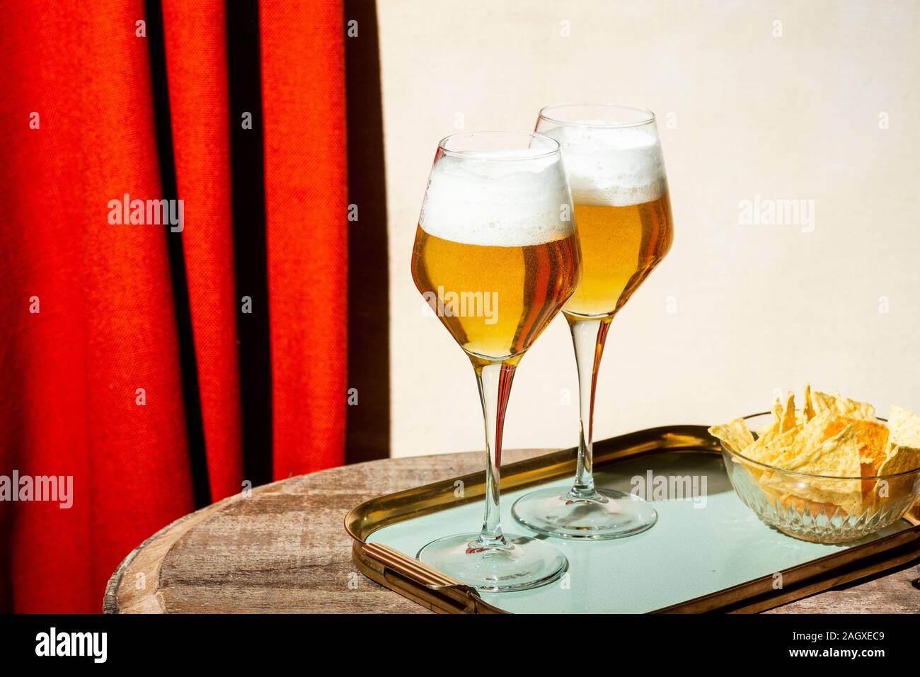 Beer in flute, pils or pilsner, with tortilla chips, light colorful ...