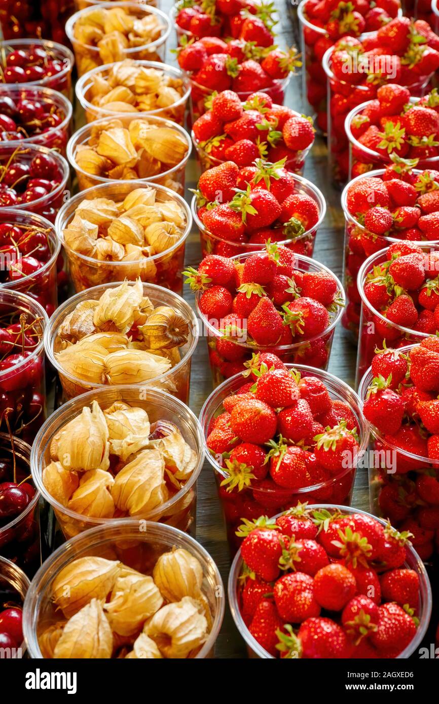 Rasbhari raspberry, strawberry, cherries in plastic containers. Fresh ...