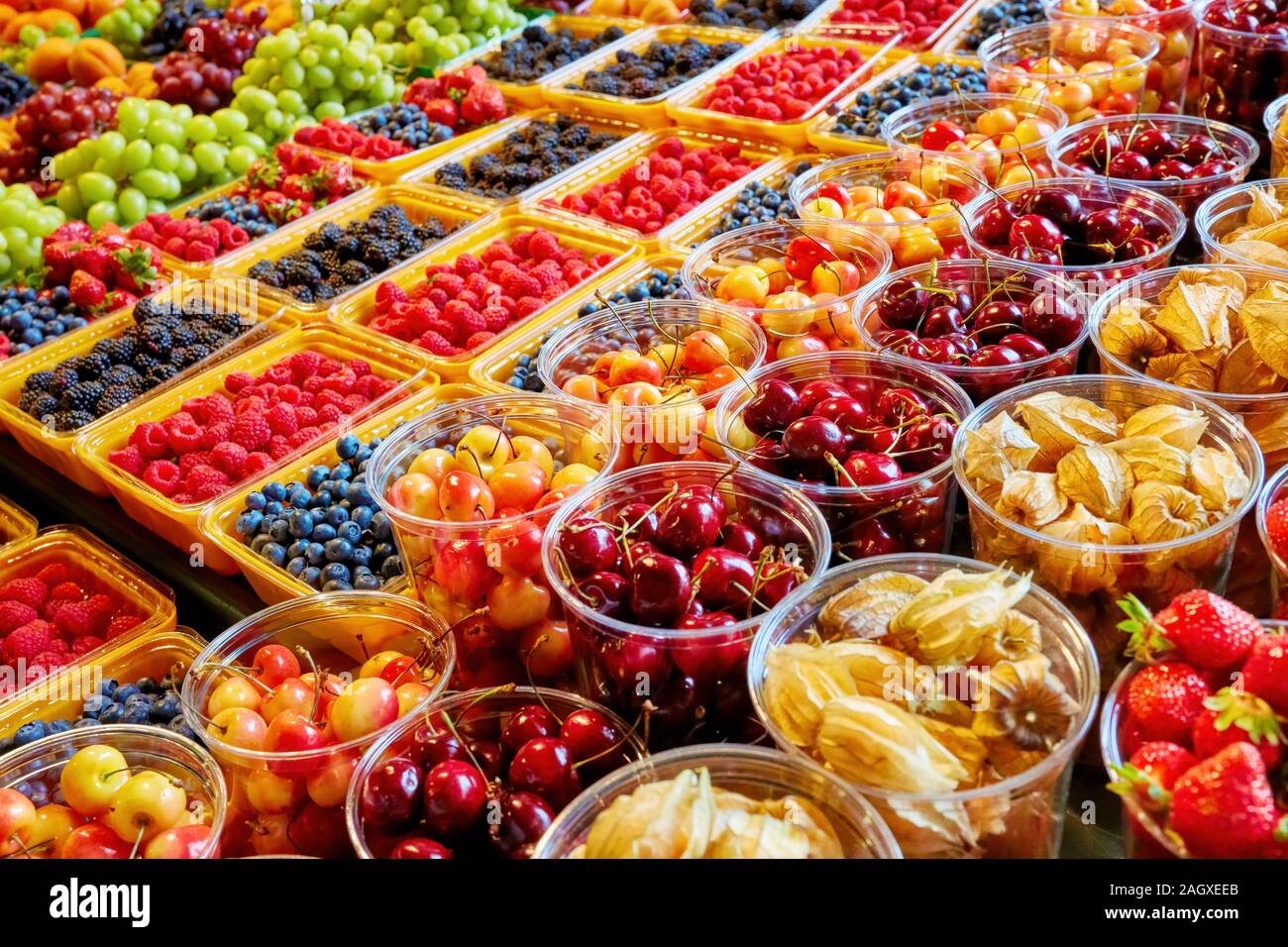 Fresh fruits at display on farmers market stall.Rasbhari raspberry ...