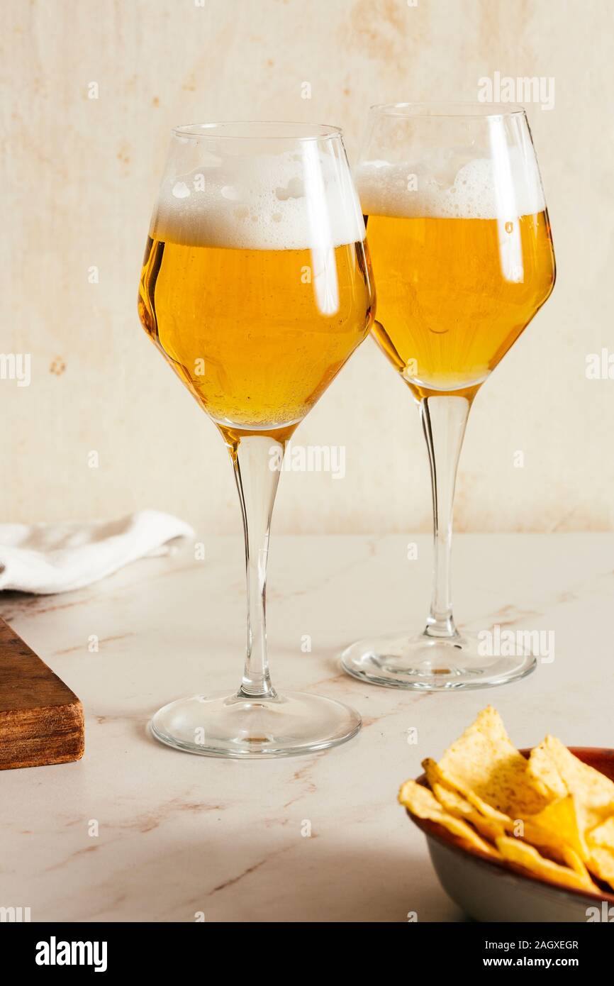 Beer in flute, pils or pilsner, with tortilla chips, light colorful ...