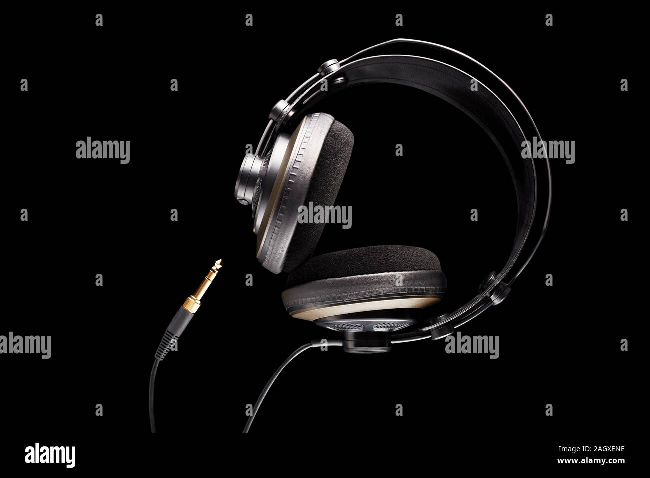 Professional studio headphones and jack on isolated black background ...
