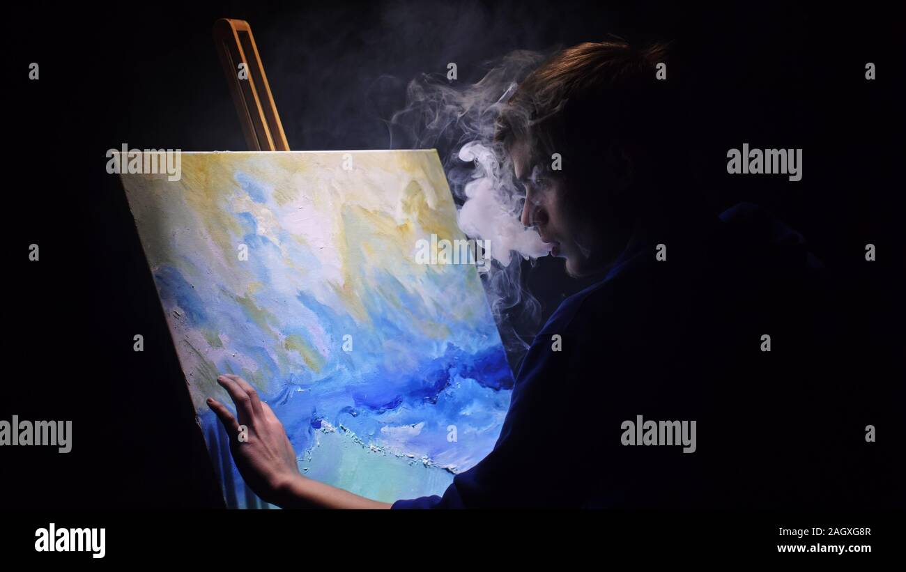 Artist copyist paint seascape with ship in ocean. Vaper smoke vape e ...