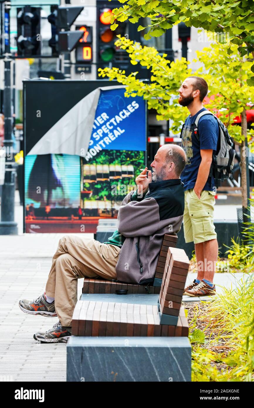 Homeless man smoking cigarette hi-res stock photography and images - Alamy