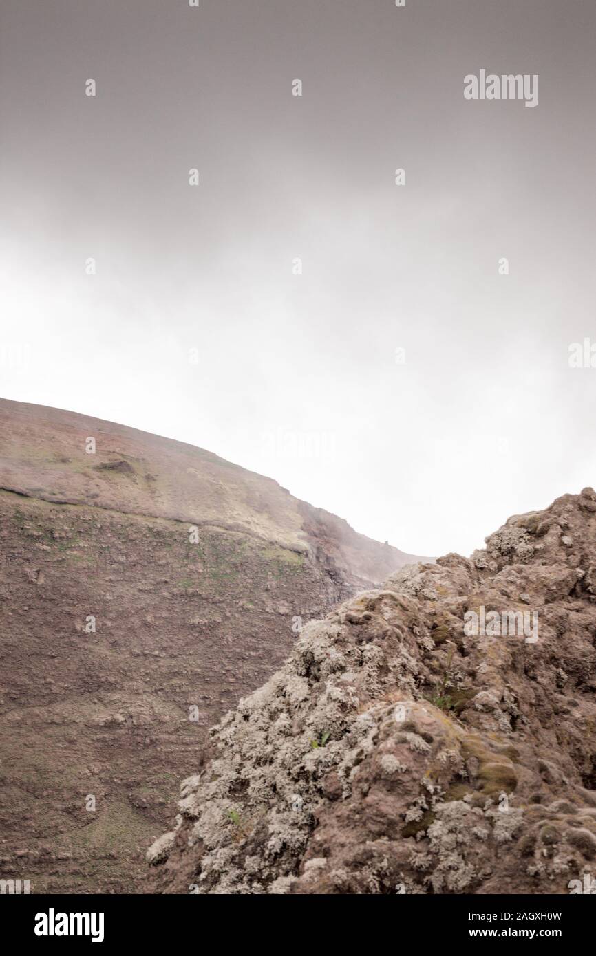 on top of mount vesuvius looking at the side of the volcano in italy ...