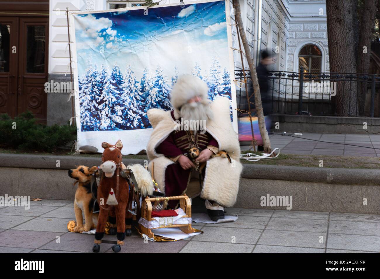 Georgian Santa Claus in national clothes on the street. Shota Rustaveli ...