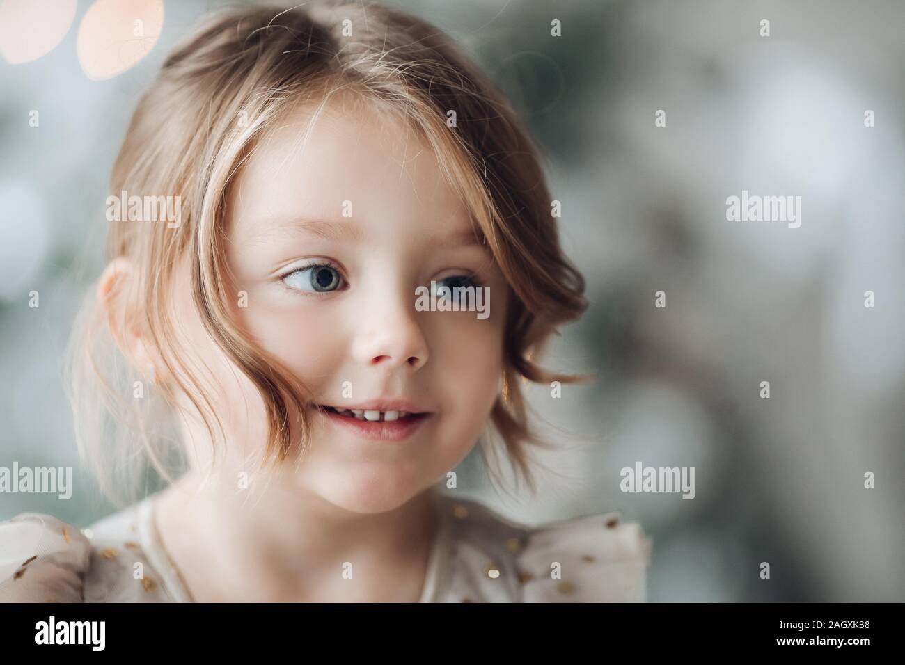 Beautiful little girl smiling away. Adorable young girl smiling away in ...