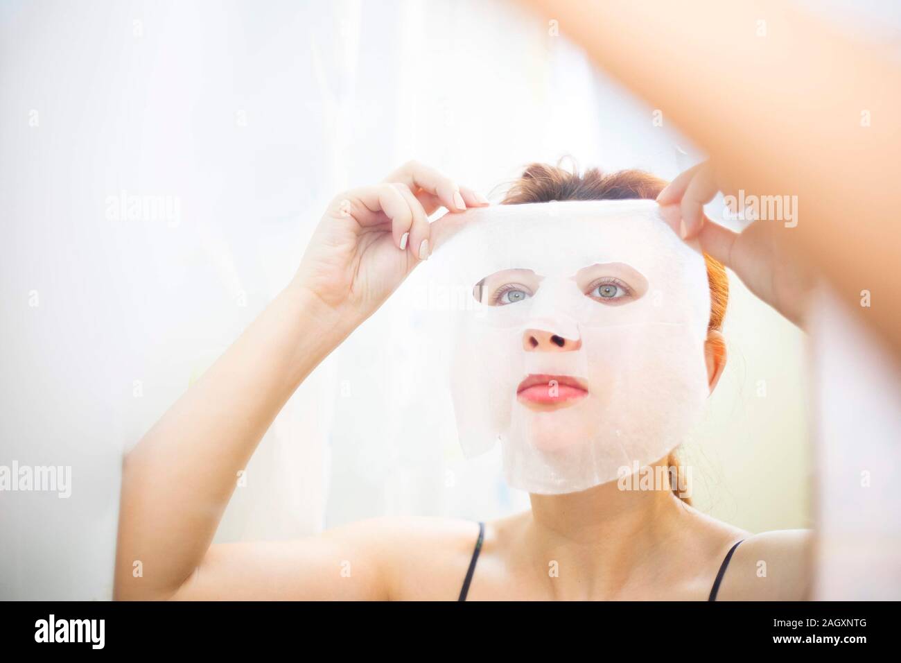 Young girl with facial mask. Cosmetic manipulation. Beauty spa and ...