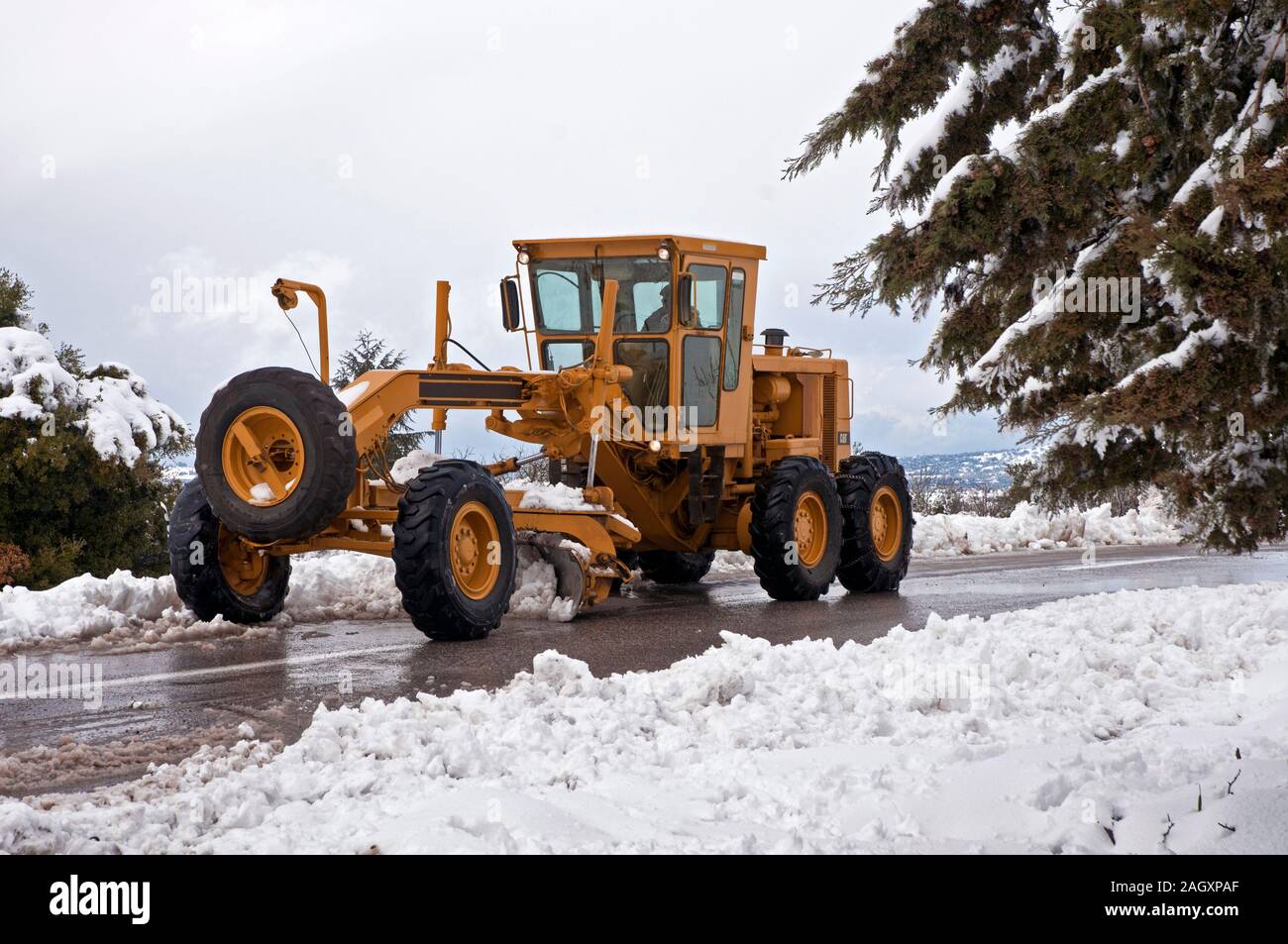 Snow removing Tractor Stock Photo - Alamy