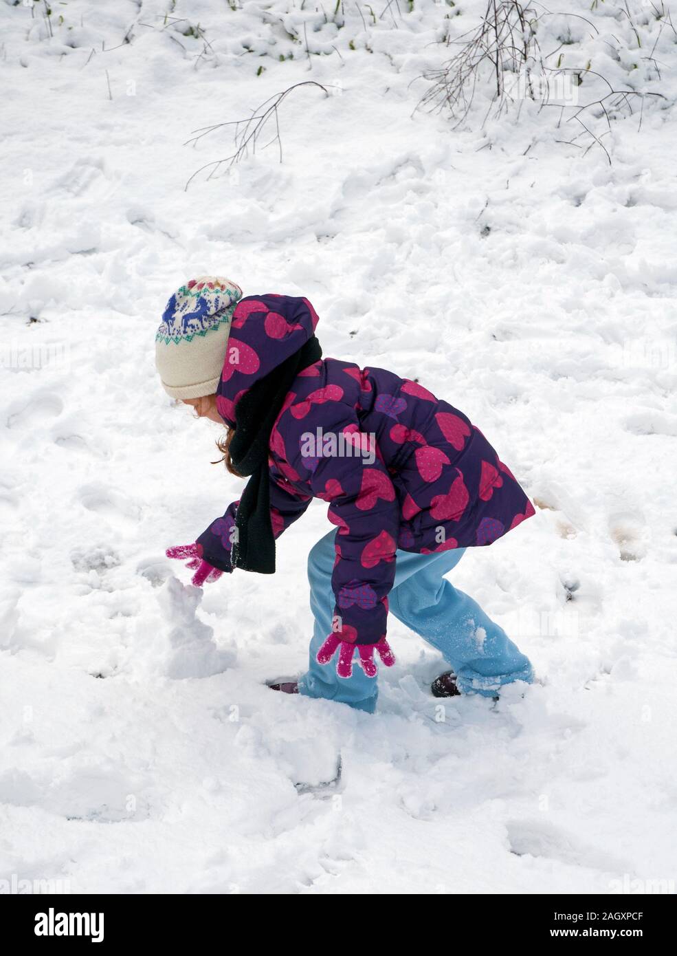 Kid snow pile hi-res stock photography and images - Alamy