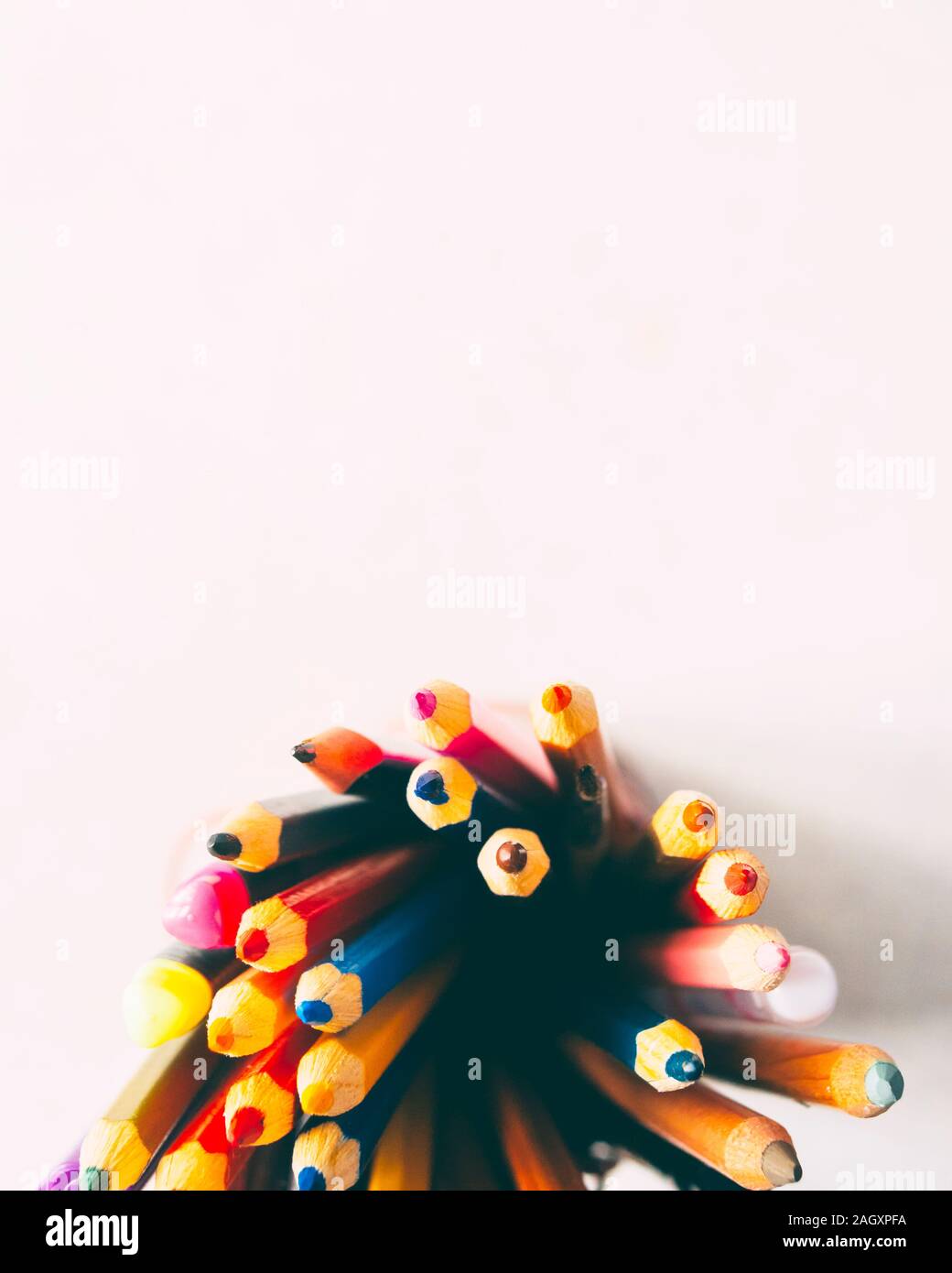 Colored pencils on the white background. Flat lay. Crop for instagram ...