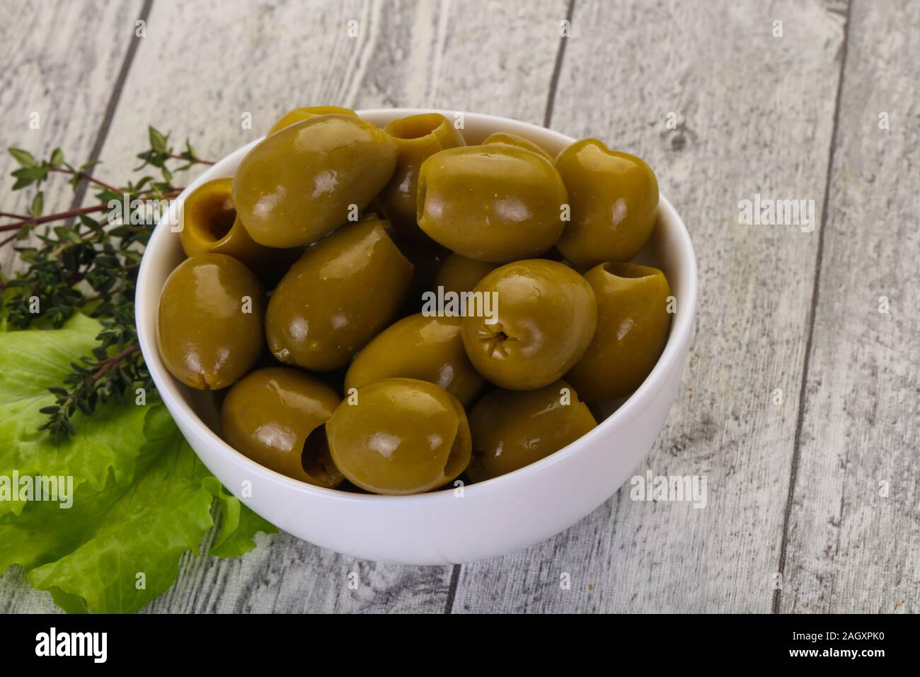 Big green olives in the bowl Stock Photo - Alamy