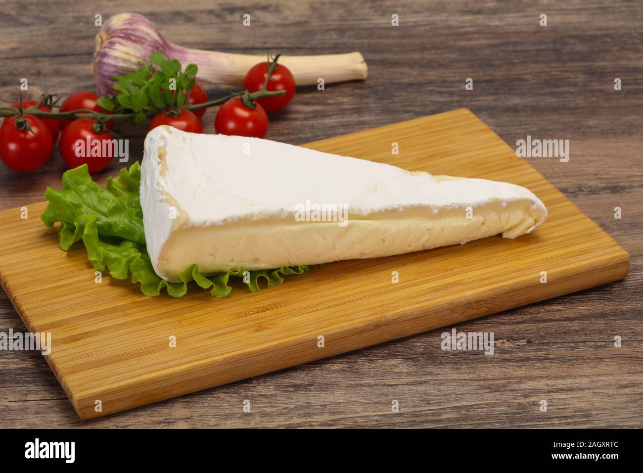 Brie cheese triangle served salad leaves Stock Photo - Alamy