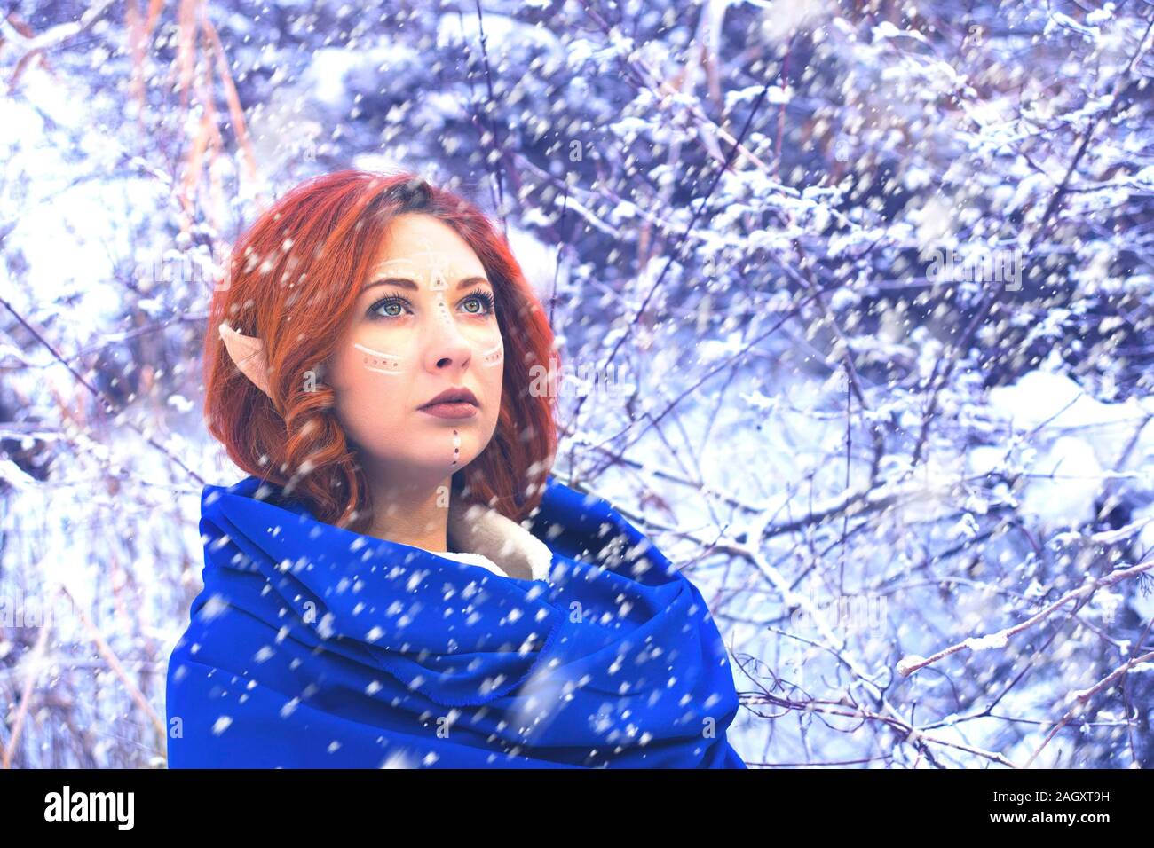 Elf Fairy woman. A fairy elf princess with snow ice on winter with blue ...