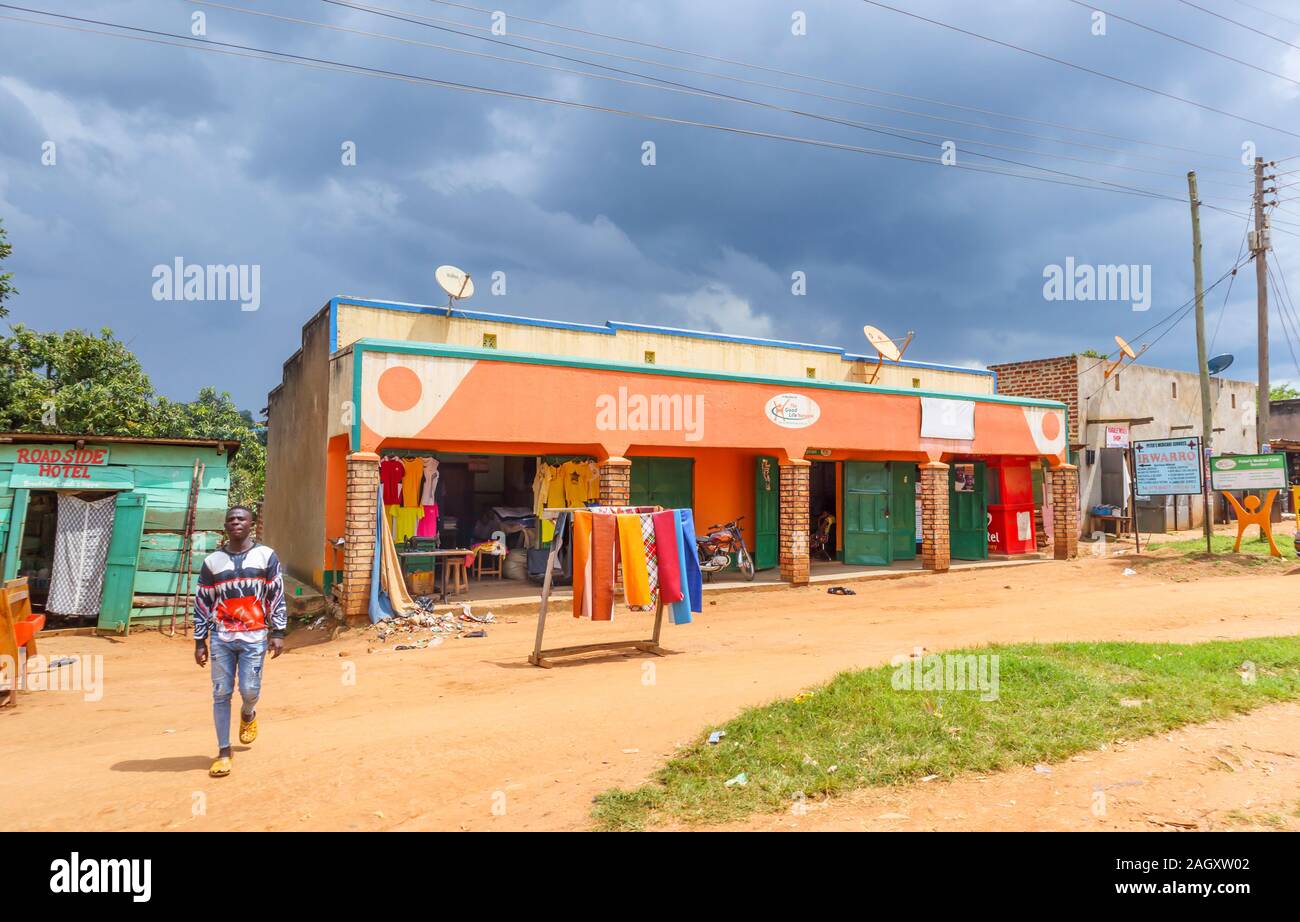 Typical colourful low-rise roadside village shops and buildings for ...
