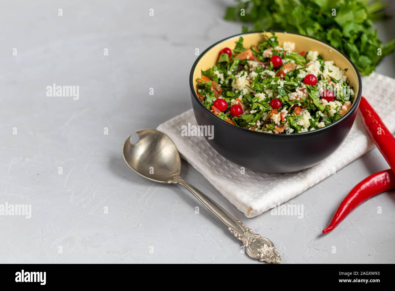 Tabbouleh salad in a round plate Stock Photo - Alamy