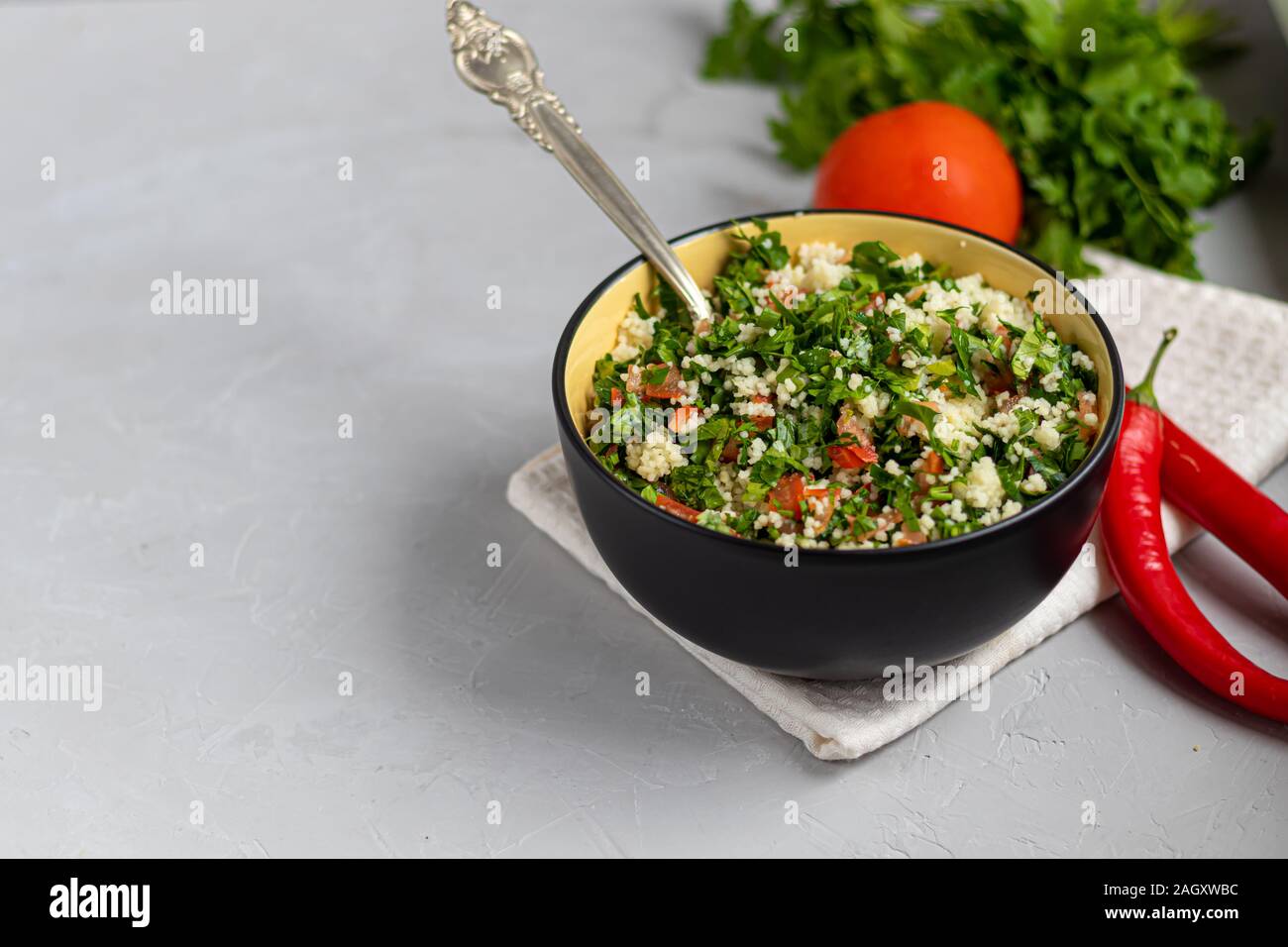 Tabbouleh salad in a round plate Stock Photo - Alamy