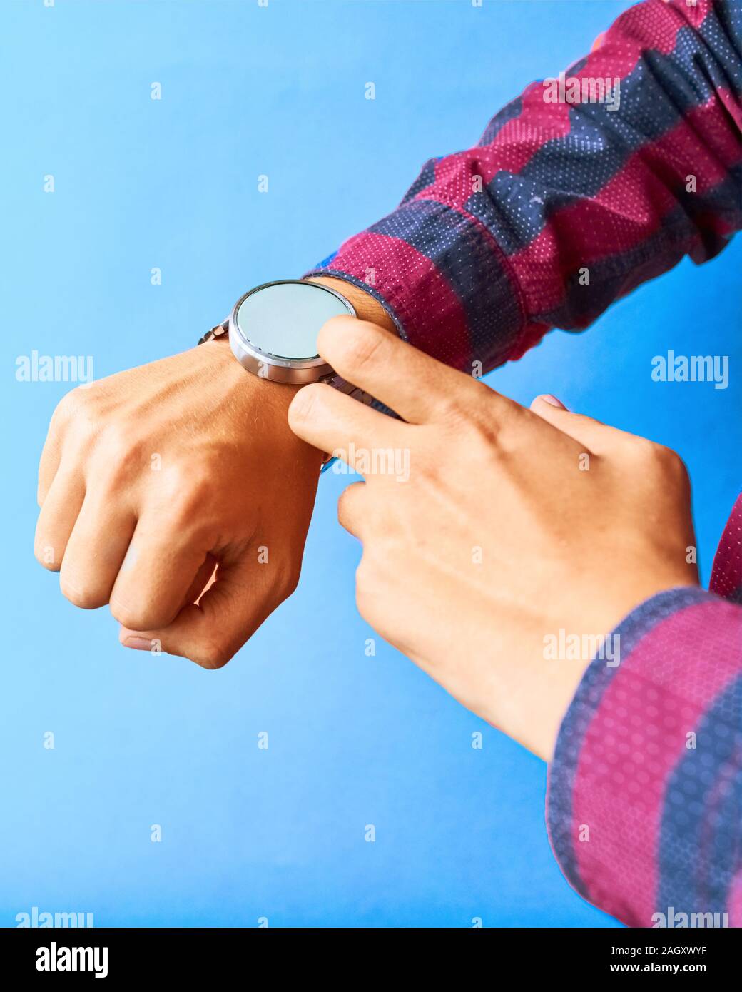 Man wear smart watch in everyday lifestyle with blank screen. He using ...