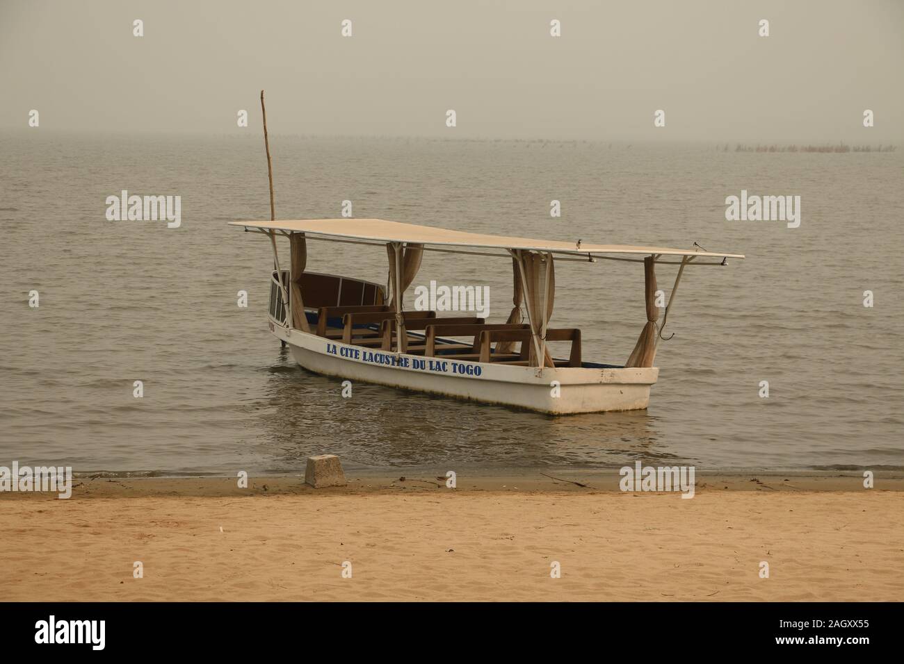 A tourist boat for transport to another city at the lake. Lake Togo ...