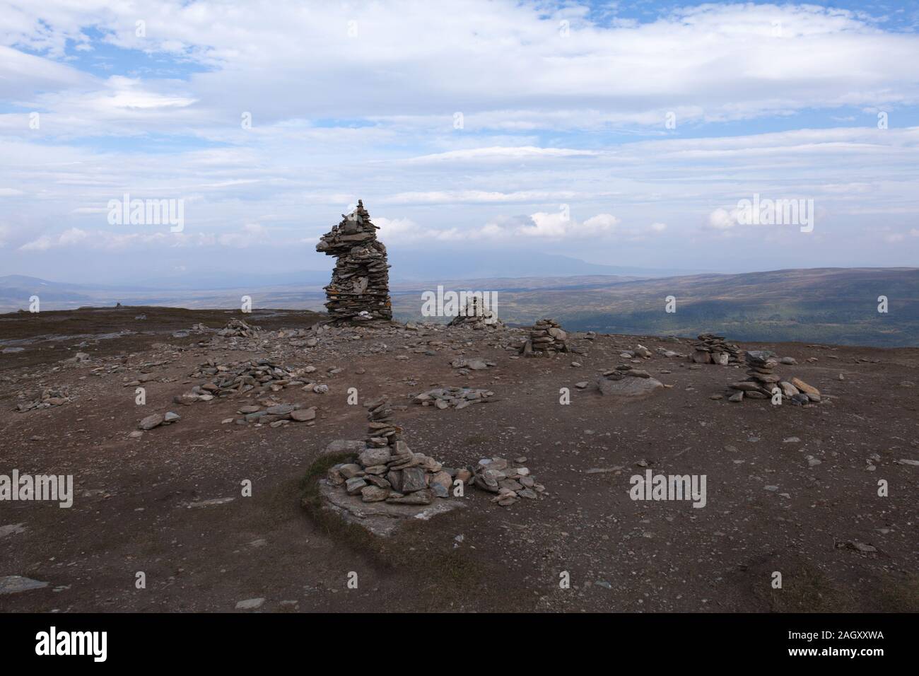 The very top of a mountain. View, outlook and cairn, mound of stones ...