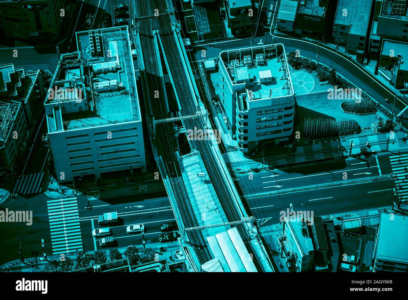 Urban core in Tokyo, Japan. Railway tracks with buildings. High angle ...