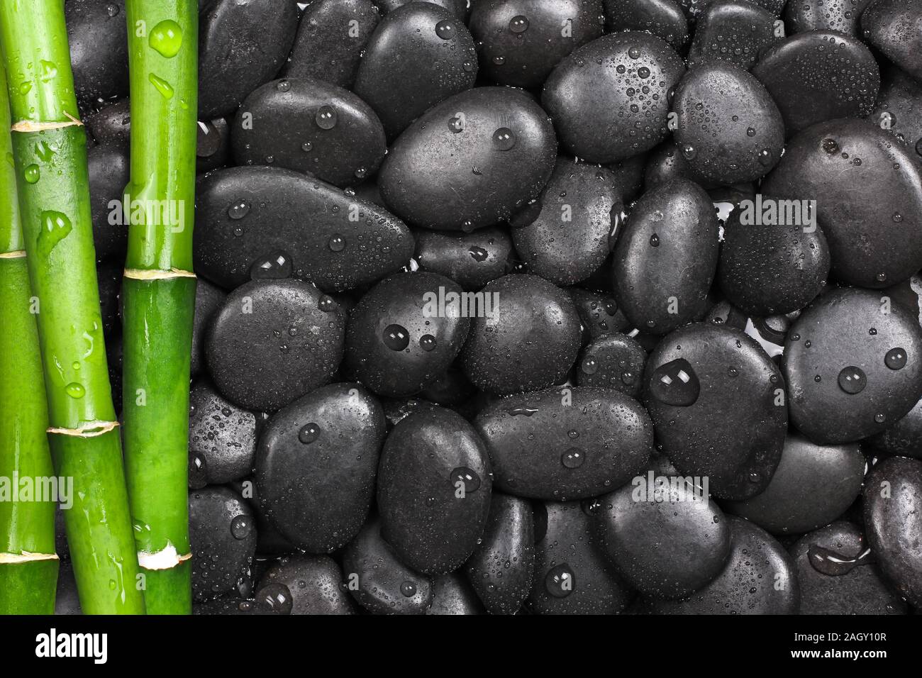 Hot stones with bamboo Stock Photo - Alamy