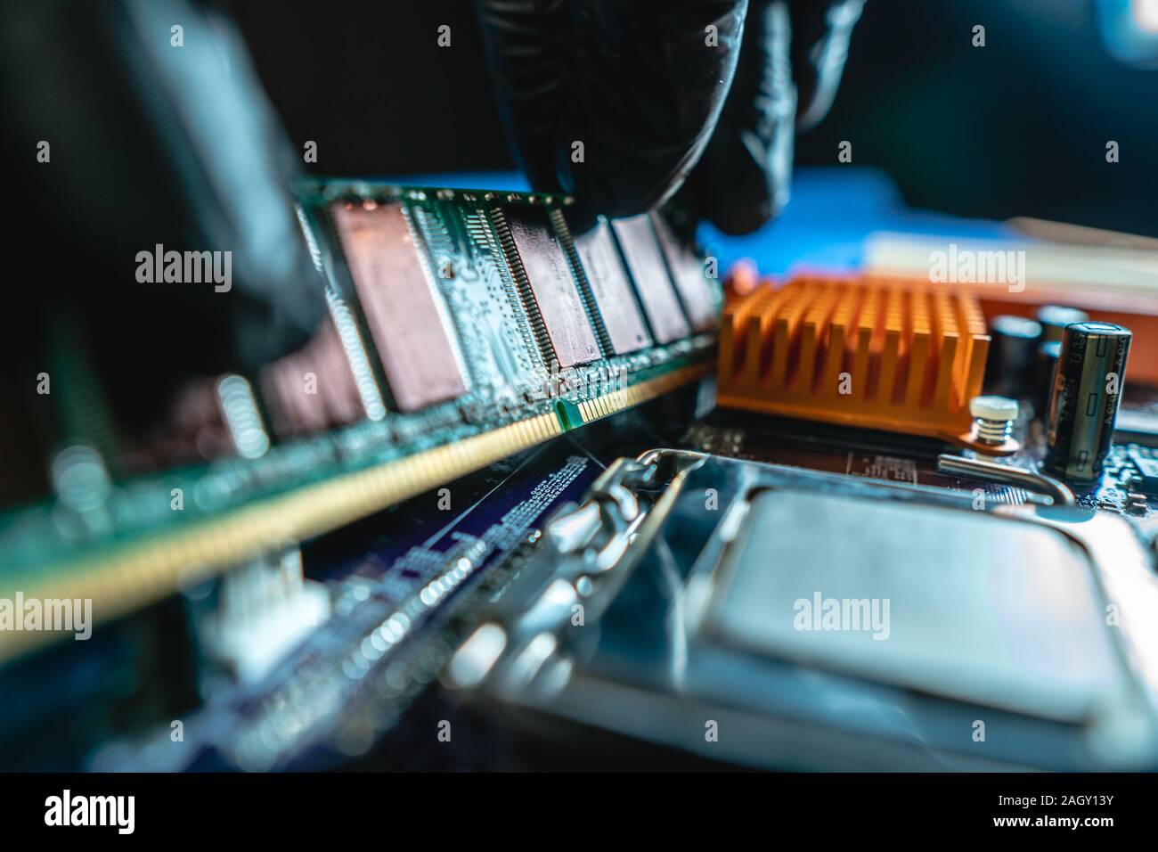 Engineer repairman holding hands in black gloves RAM memory to insert ...