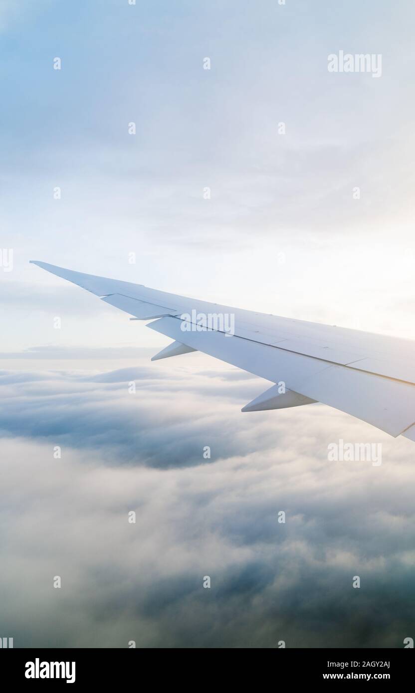 Wing of an airplane seen from the window during the flight Stock Photo ...