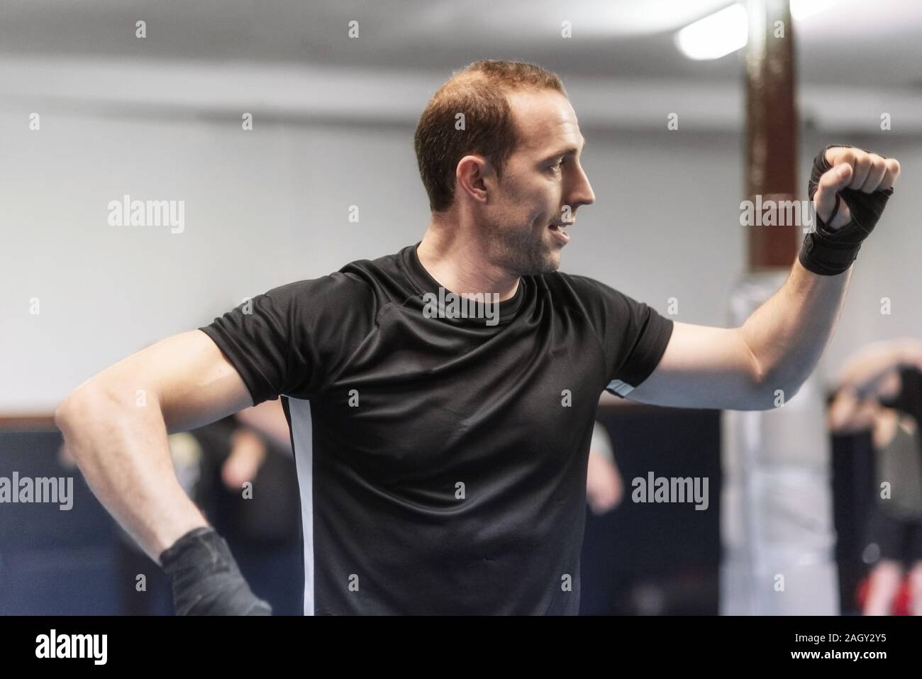 Fitness man warming up in gym. Preparing kick boxing combat Stock Photo ...