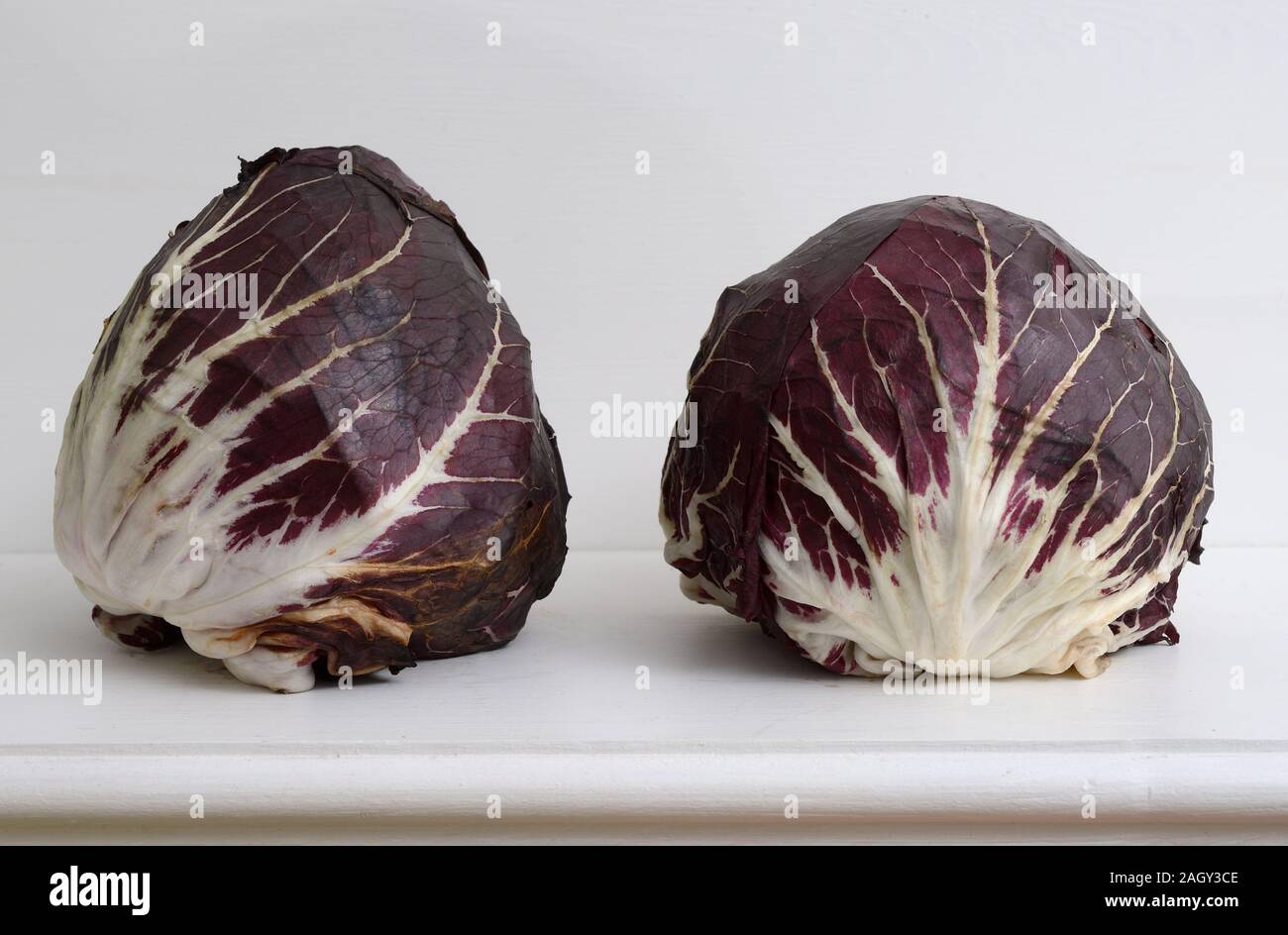 two heads of red cabbage on a shelf Stock Photo - Alamy