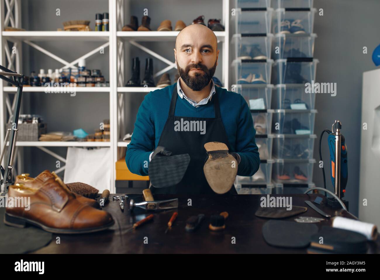 Shoe repair craftsman hi-res stock photography and images - Alamy