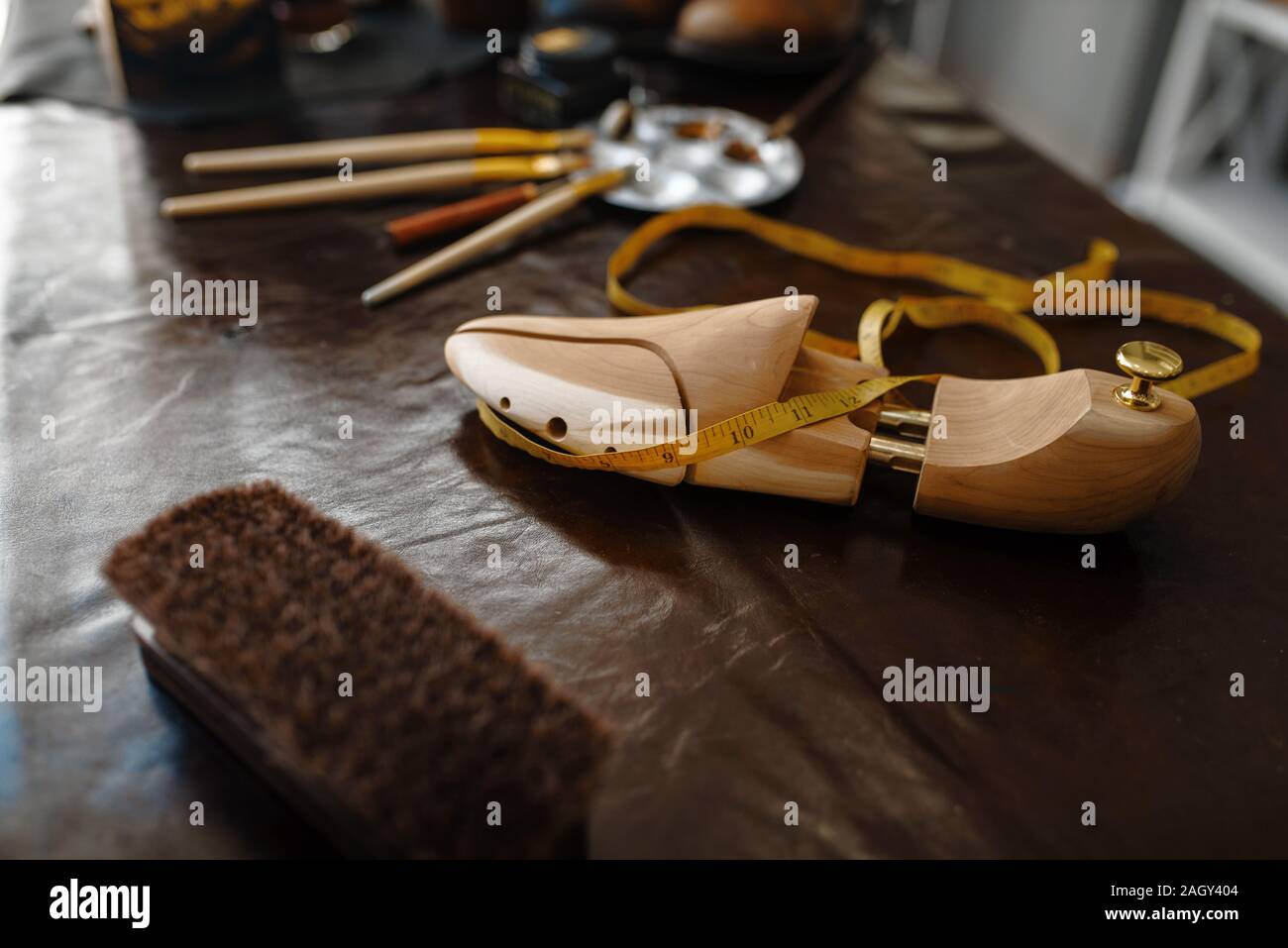 Shoemaker occupation, footwear repair concept Stock Photo - Alamy